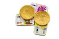 Photo of Chocolate coins wrapped in golden and silver paper | Free ...